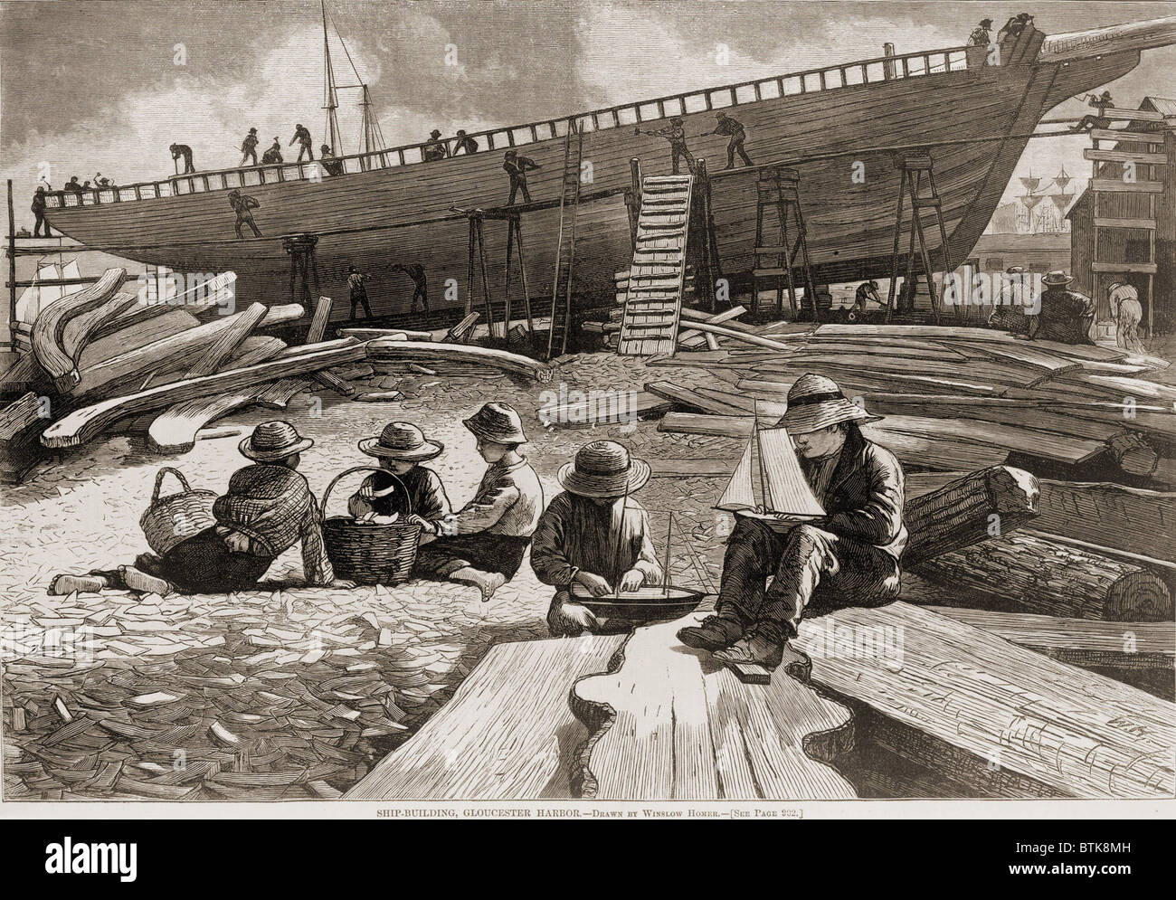 Children building model ships in the foreground at a shipyard, while ...