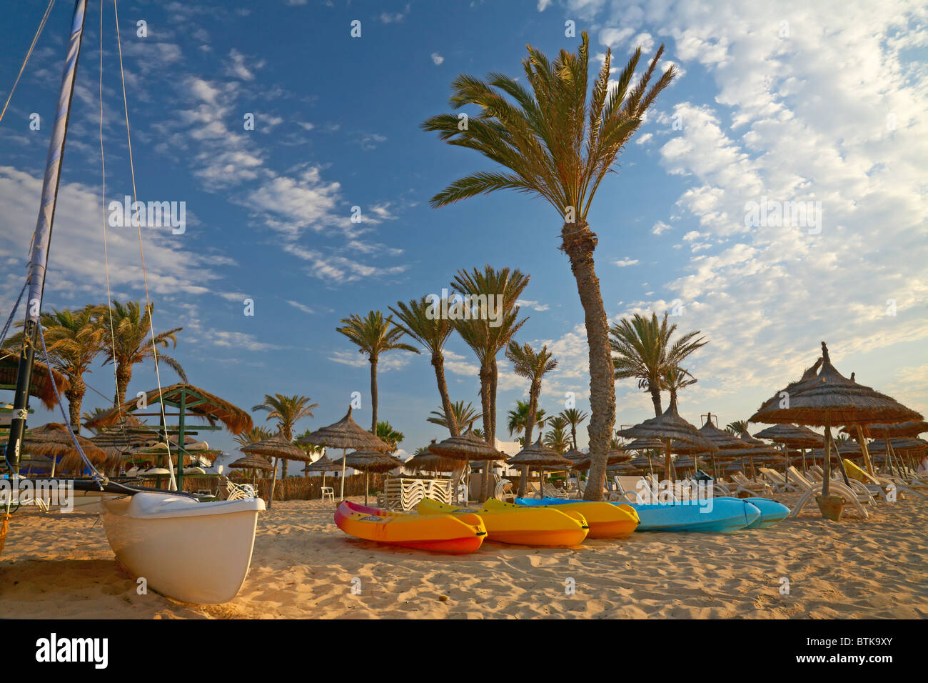 kayaks and catamaran on the beach Stock Photo - Alamy