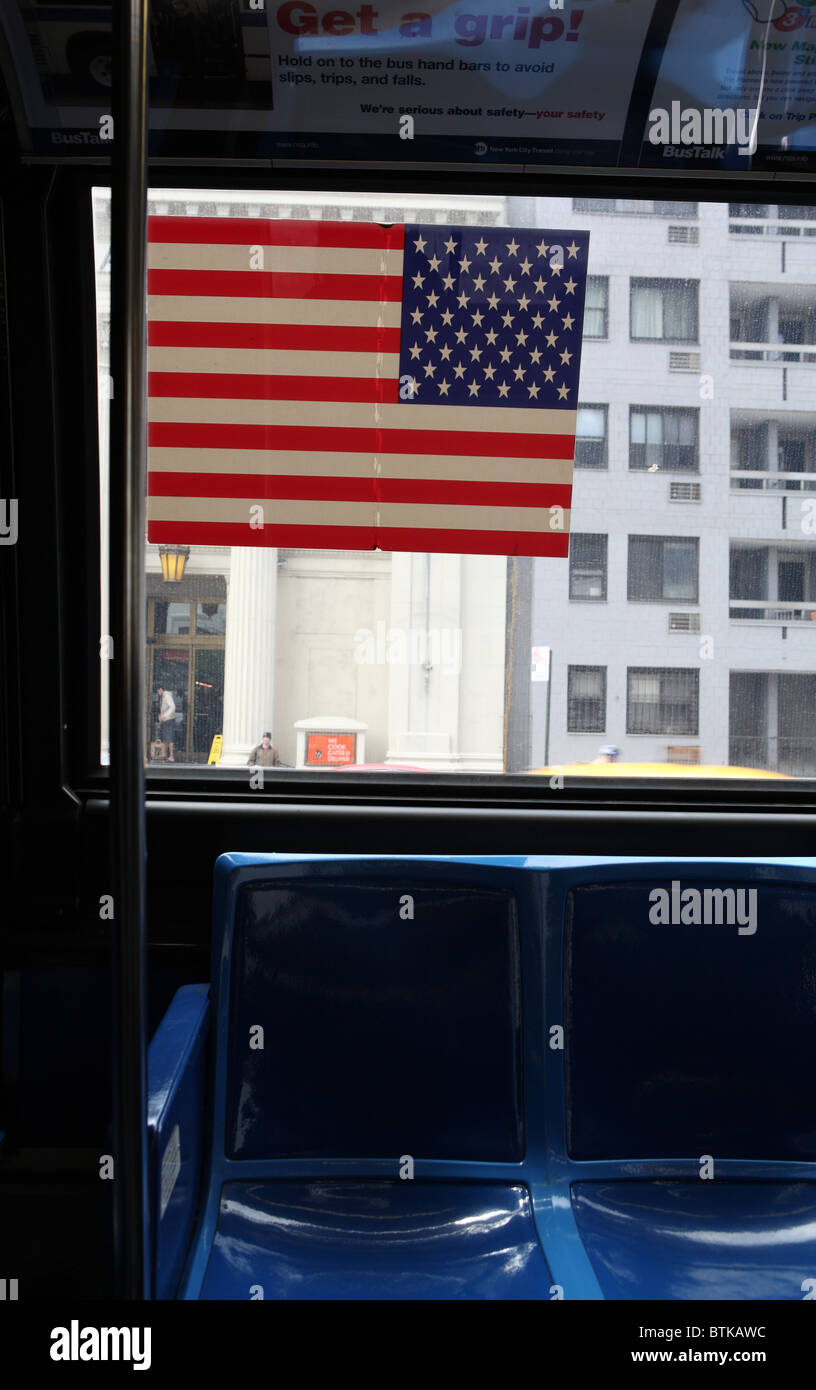An American flag in a window of a bus, New York City, USA Stock Photo ...