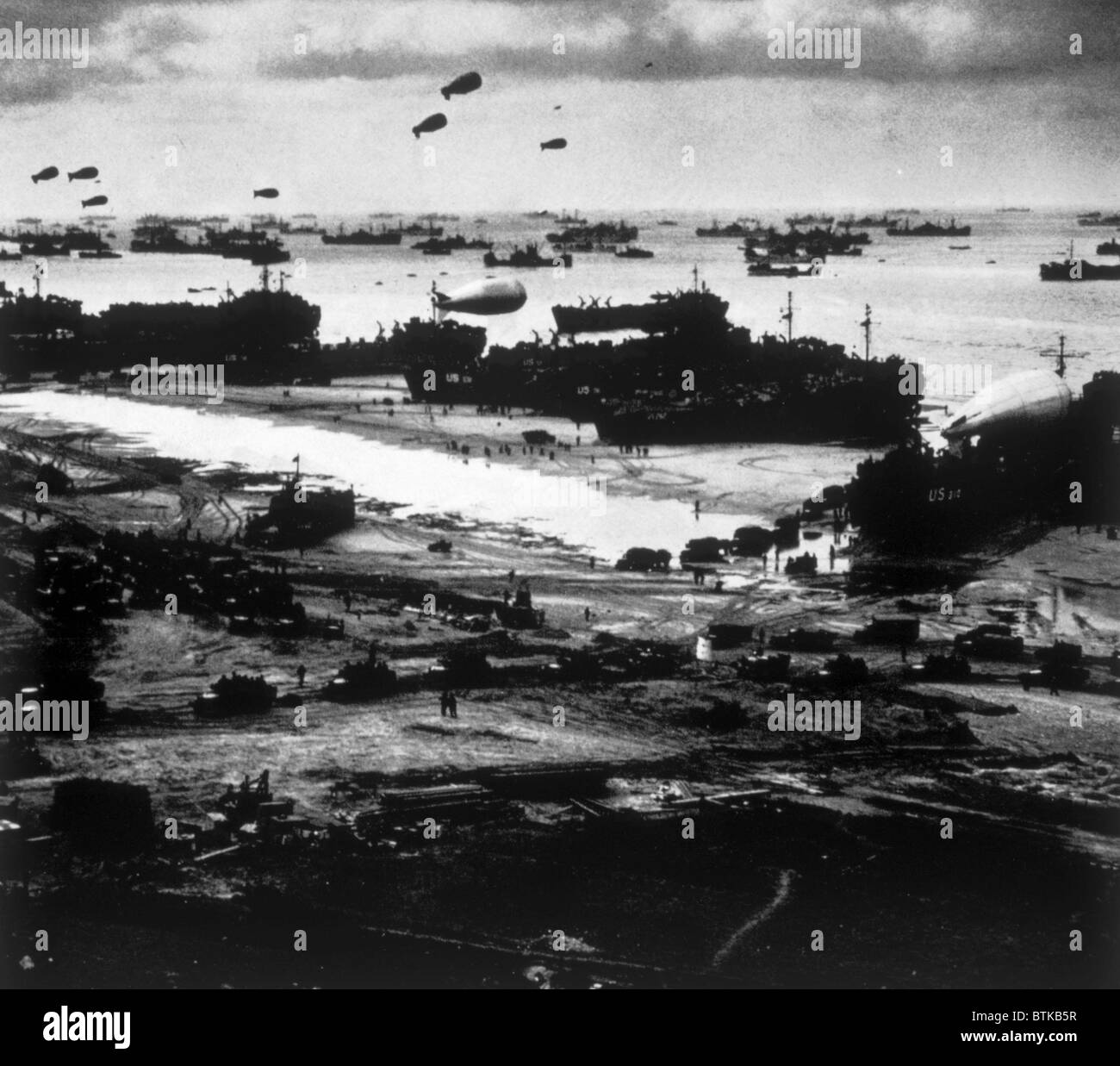 World War II, Allied ships landing military supplies on Omaha Beach ...
