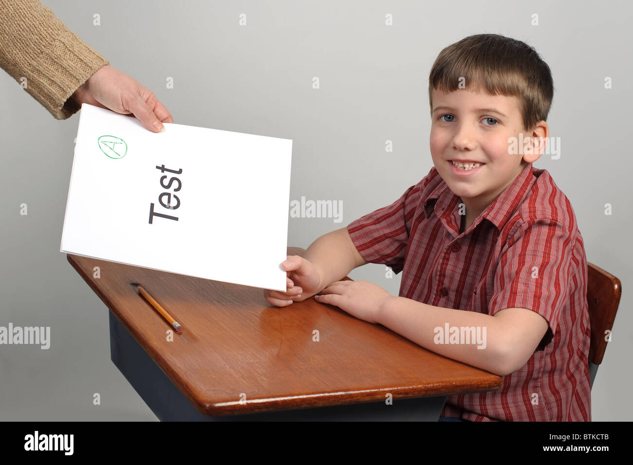 A boy receiving an "A" on a test Stock Photo - Alamy
