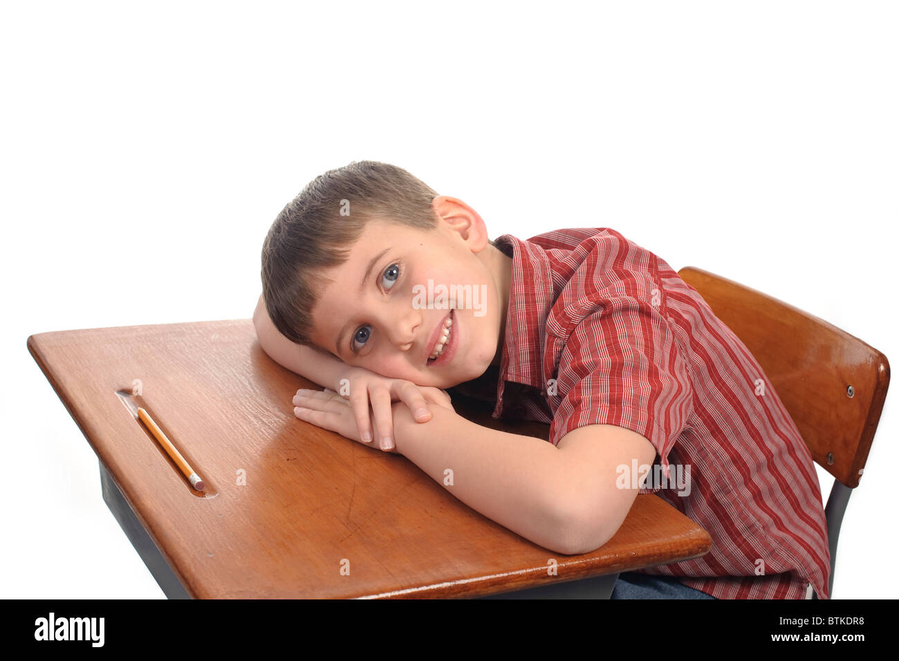 A school boy resting at his desk Stock Photo - Alamy