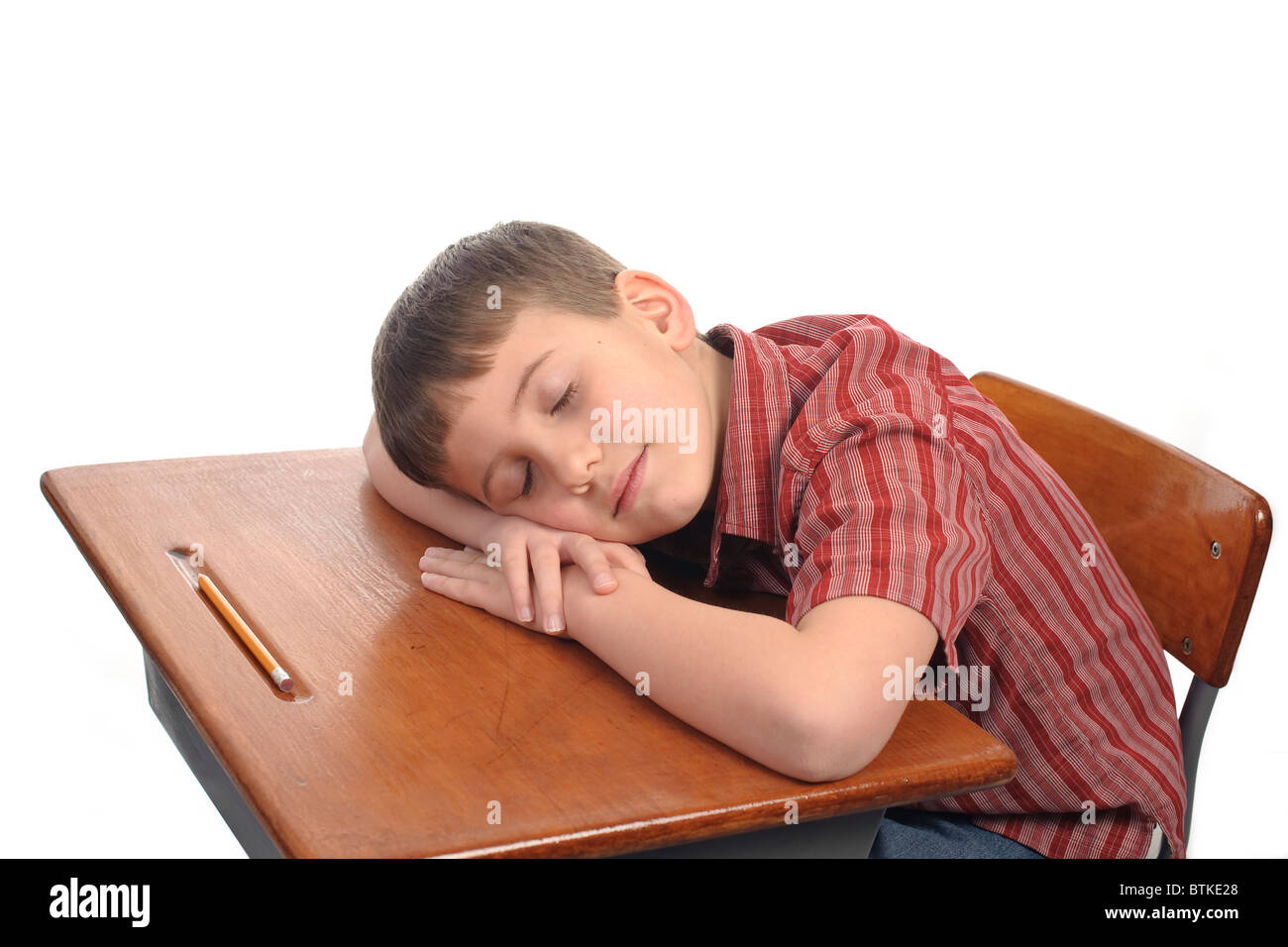 A school boy resting at his desk Stock Photo - Alamy