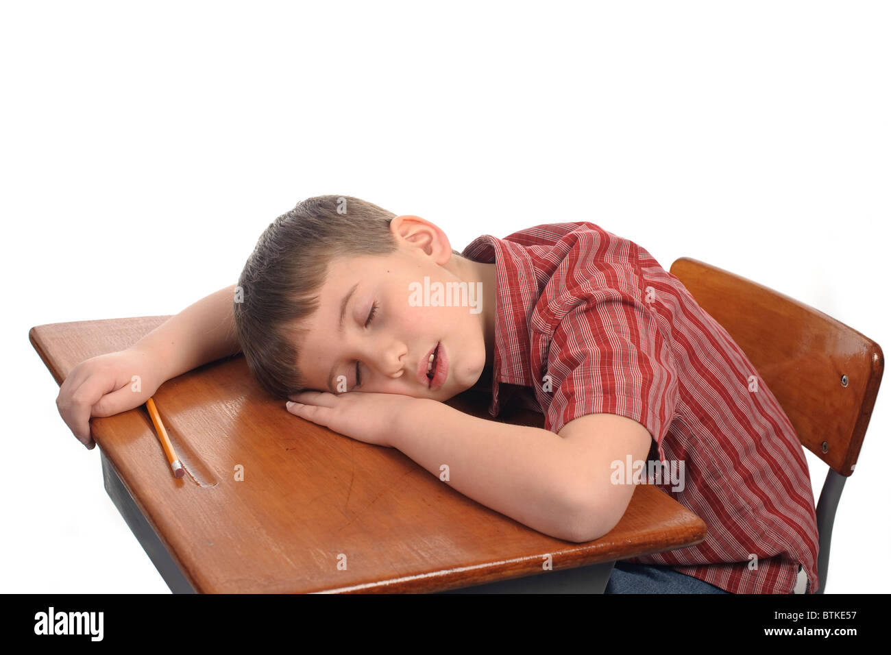 A school boy resting at his desk Stock Photo - Alamy