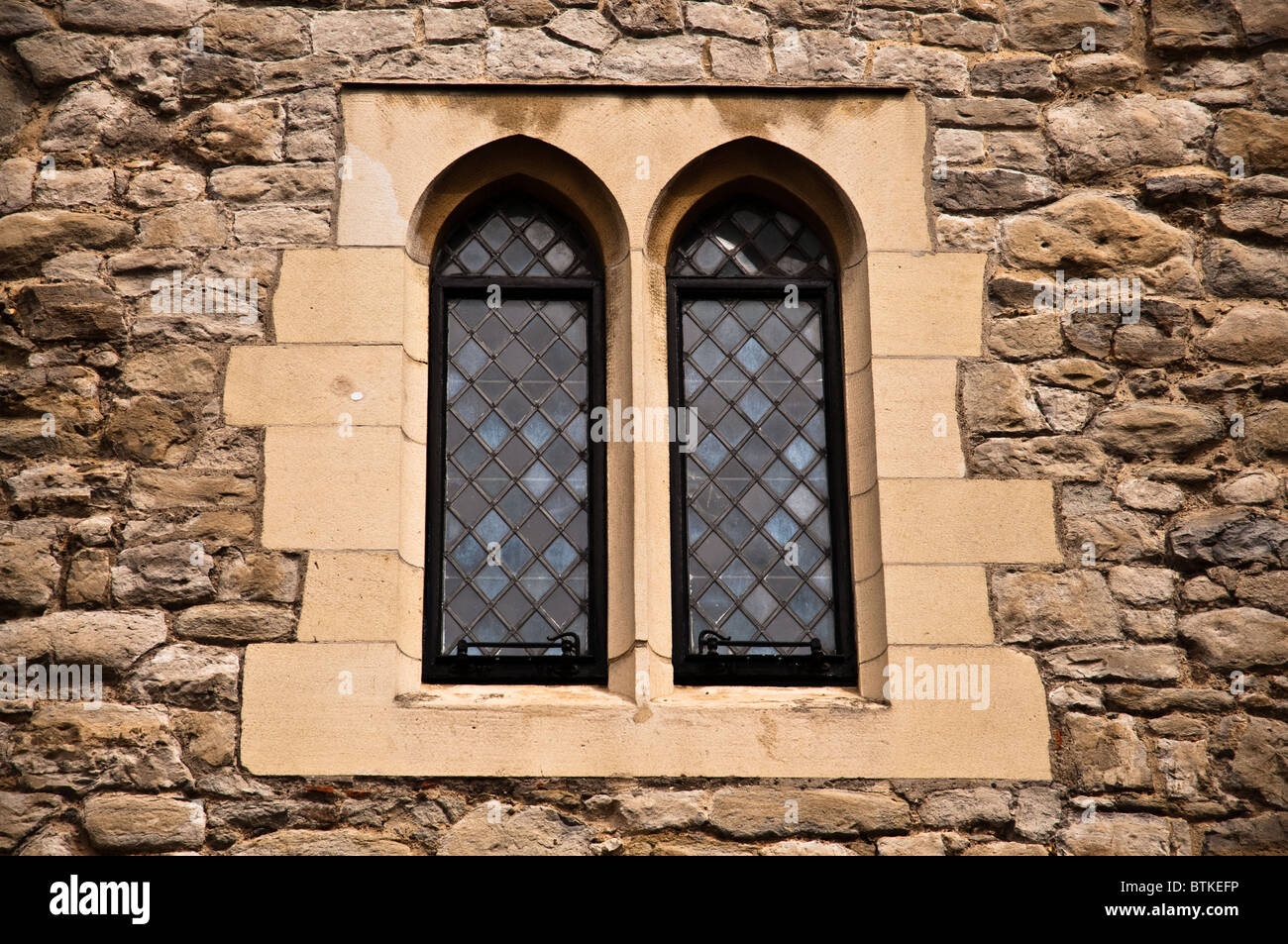 Tall arched windows in a brick wall Stock Photo - Alamy