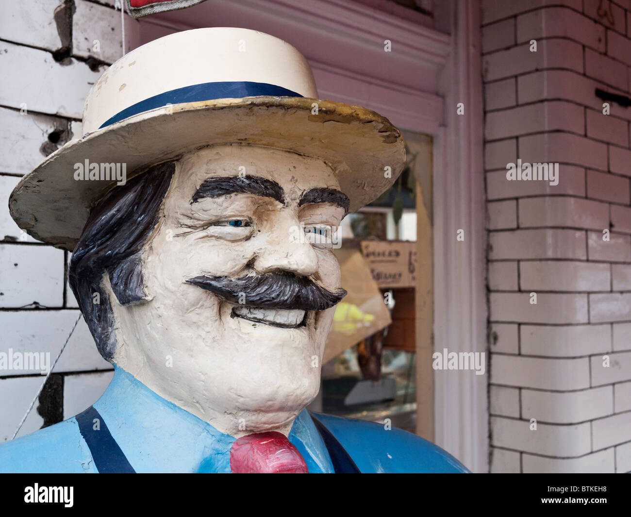 Large model figure of a butcher outside butcher's shop on English ...