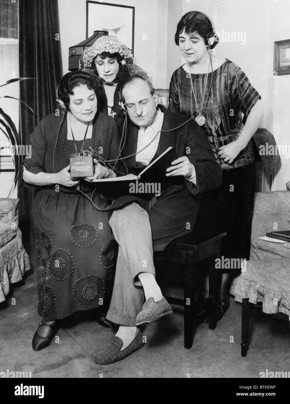 Opera stars read score of Tosca while listening to the opera via radio ...