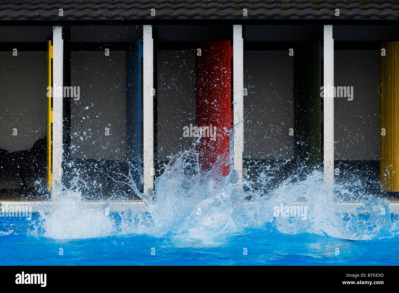 Splashes from people diving at Tooting Bec outdoor pool Stock Photo - Alamy