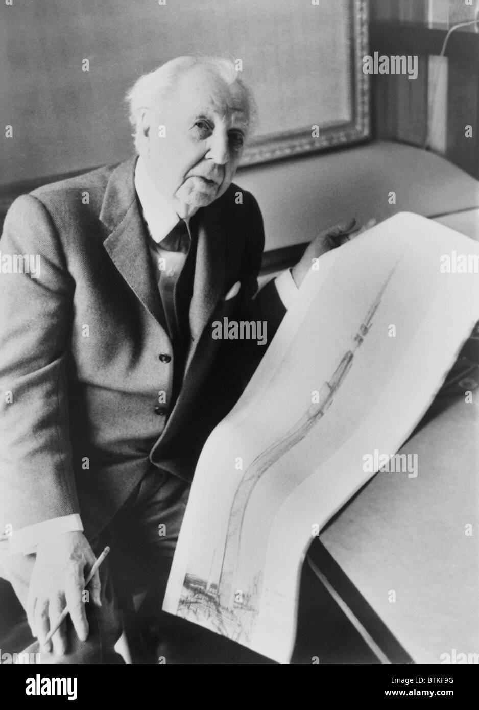 Frank Lloyd Wright (1867-1959), American master architect holding ...