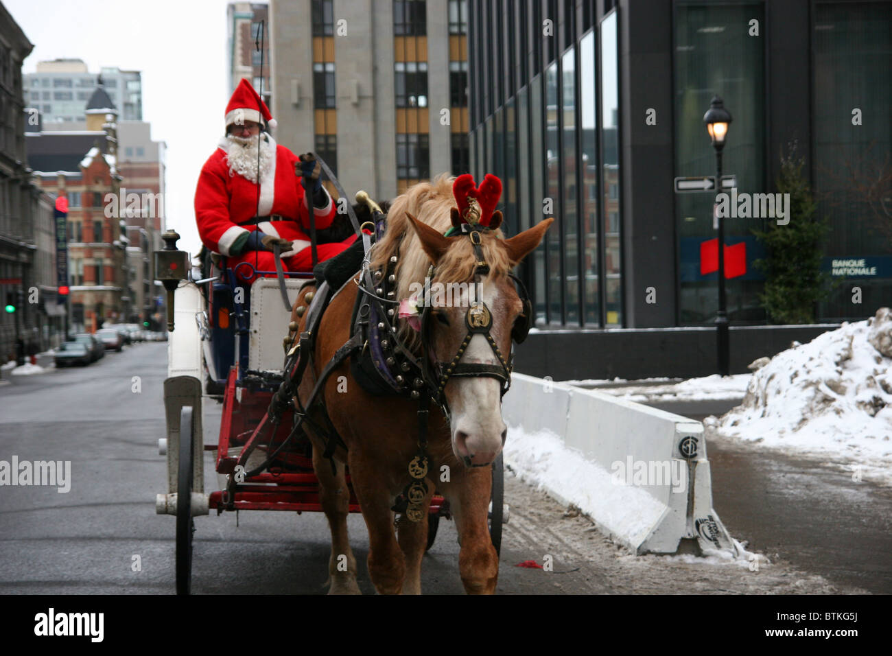 A man dressed up in Santa Claus costume on a horse-drawn carriage in ...