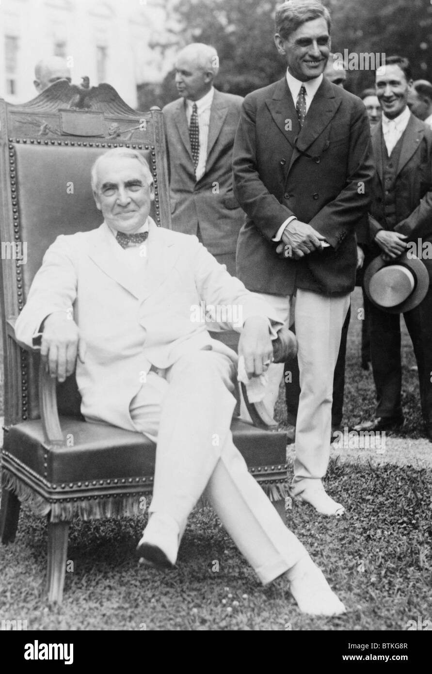 President Warren G. Harding, seated on chair presented to him by ...
