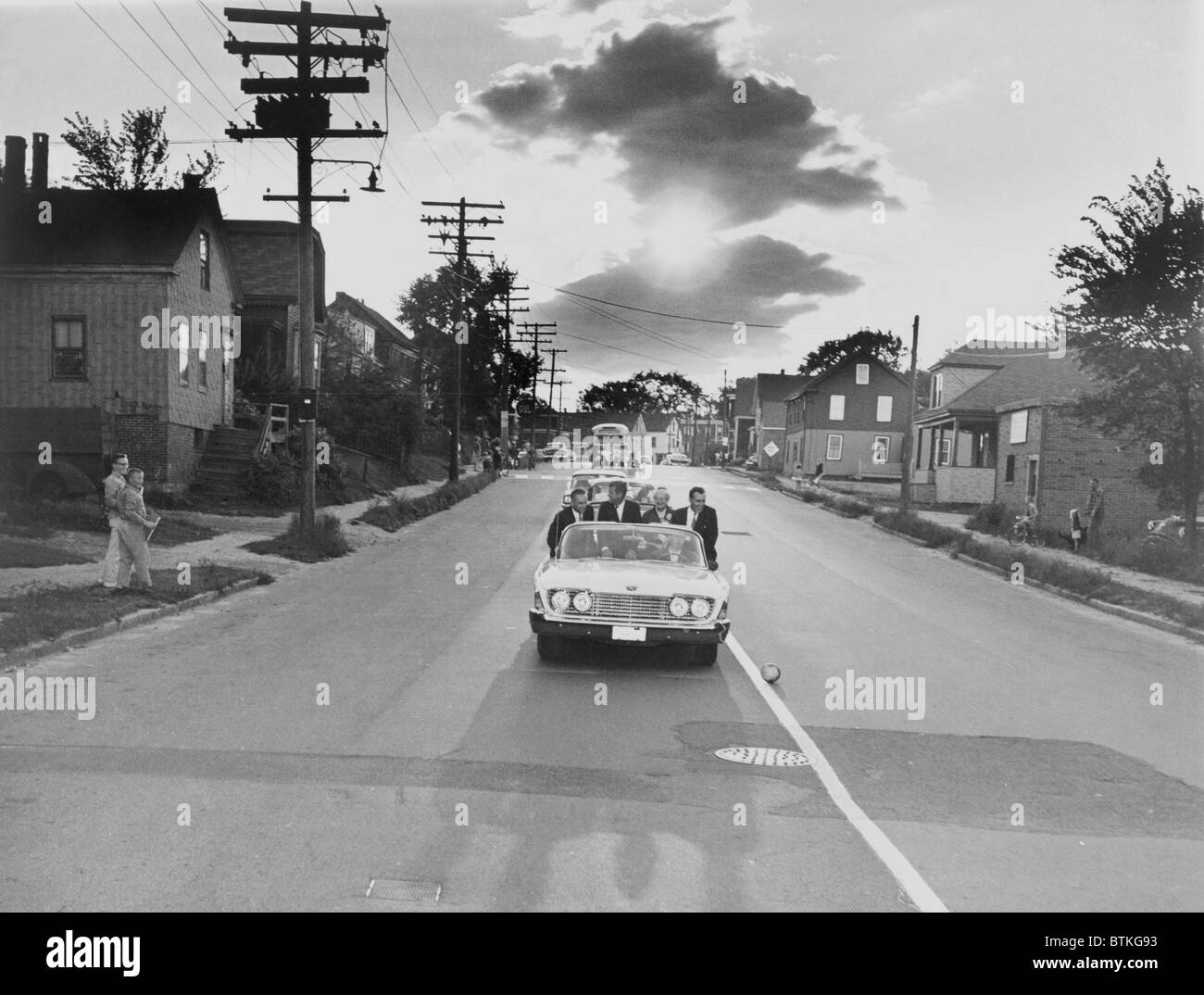Senator John F. Kennedy campaigning on the empty streets of Portland ...