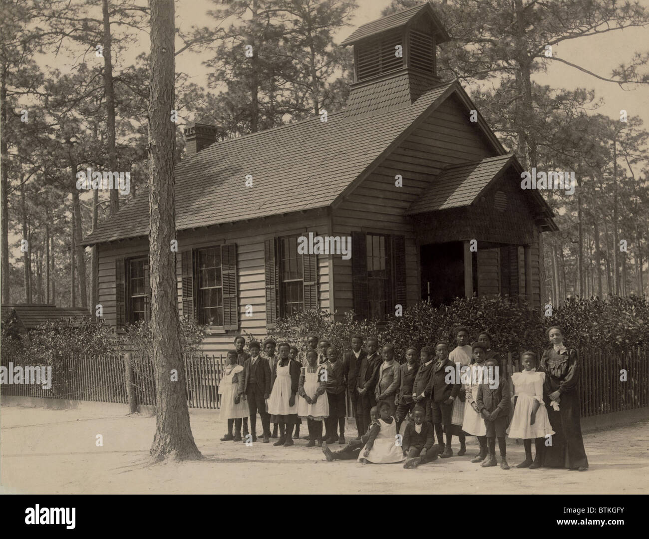 African American school children posed with their teacher outside a ...