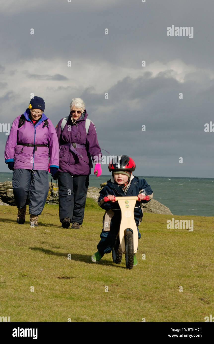 Walkers on a coastal path Stock Photo - Alamy