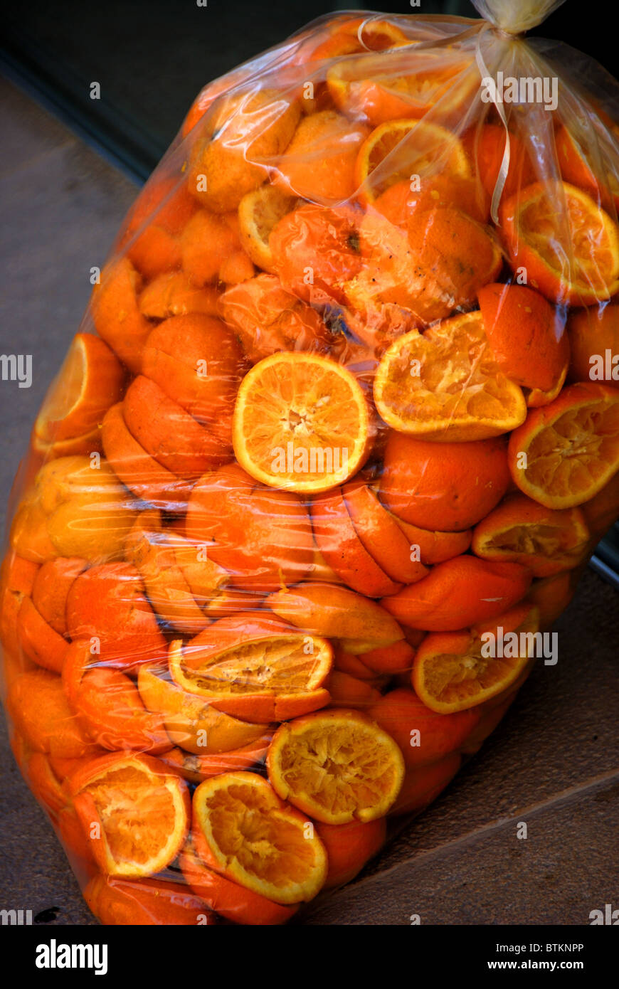 Bag of Oranges outside Spanish Cafe, after juicing Stock Photo - Alamy