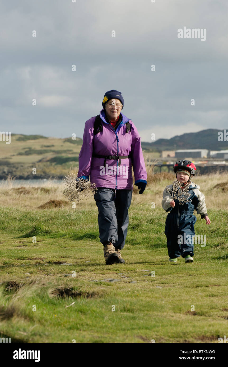 Walkers on a coastal path Stock Photo - Alamy
