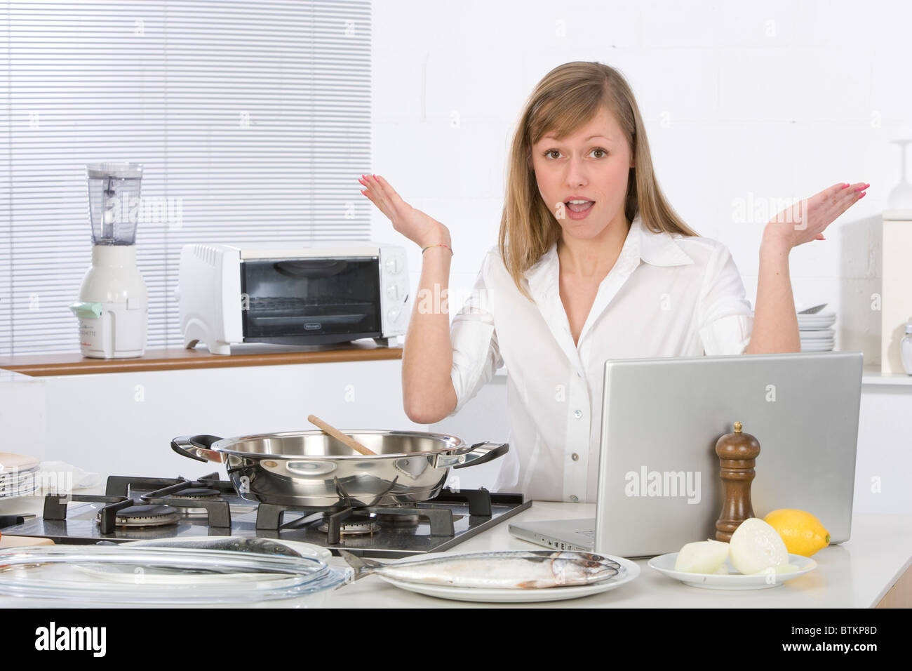 woman in the kitchen with computer Stock Photo - Alamy