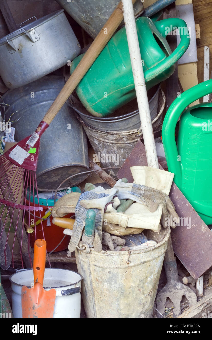 Dirty garden tools in a shed Stock Photo - Alamy