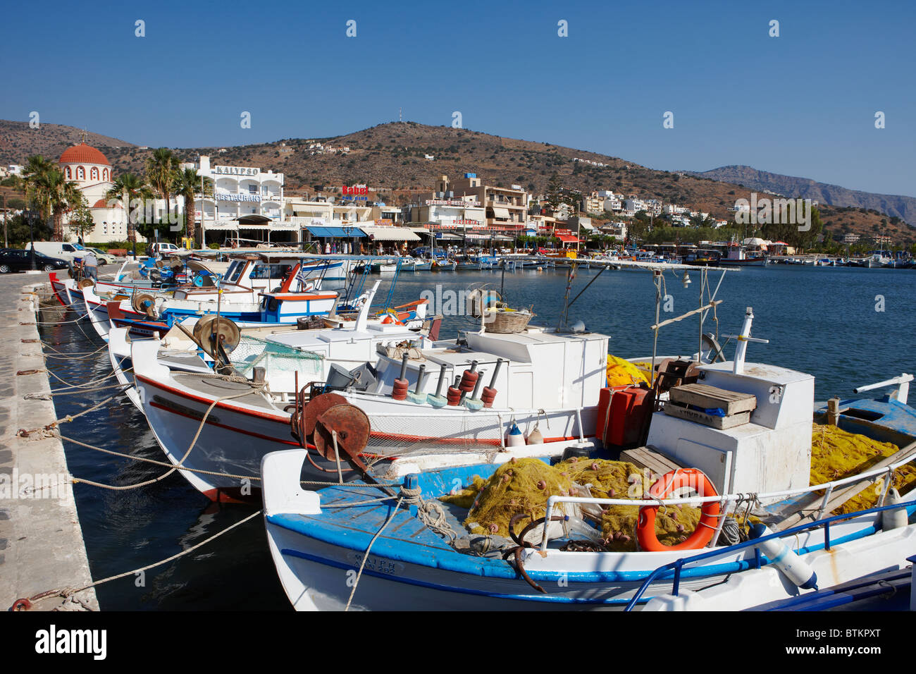 Fishing boats in Elounda village harbour. Crete, Greece Stock Photo - Alamy