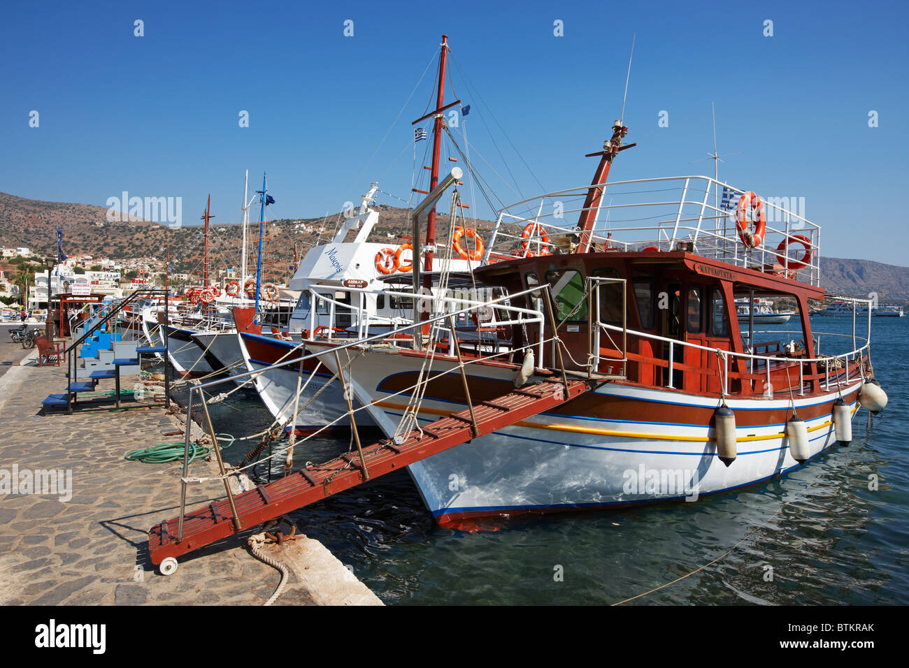 Boats in Elounda village harbour. Crete, Greece Stock Photo - Alamy