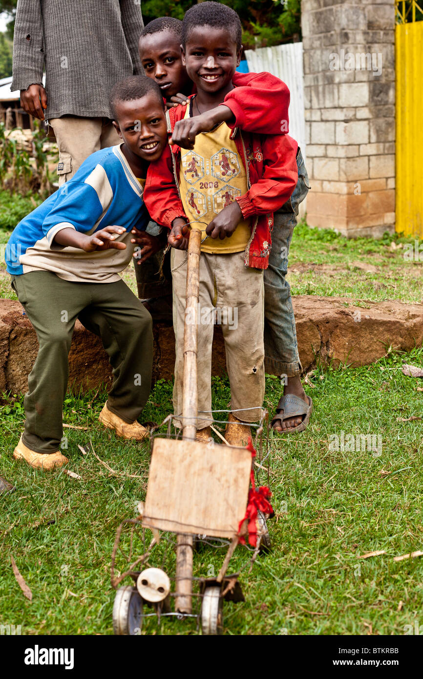 Boys and their toy cart Stock Photo - Alamy