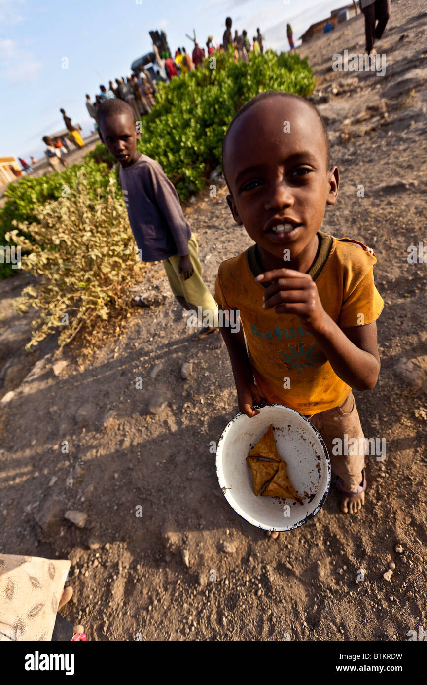 Kenyan boy selling Samosas Stock Photo - Alamy