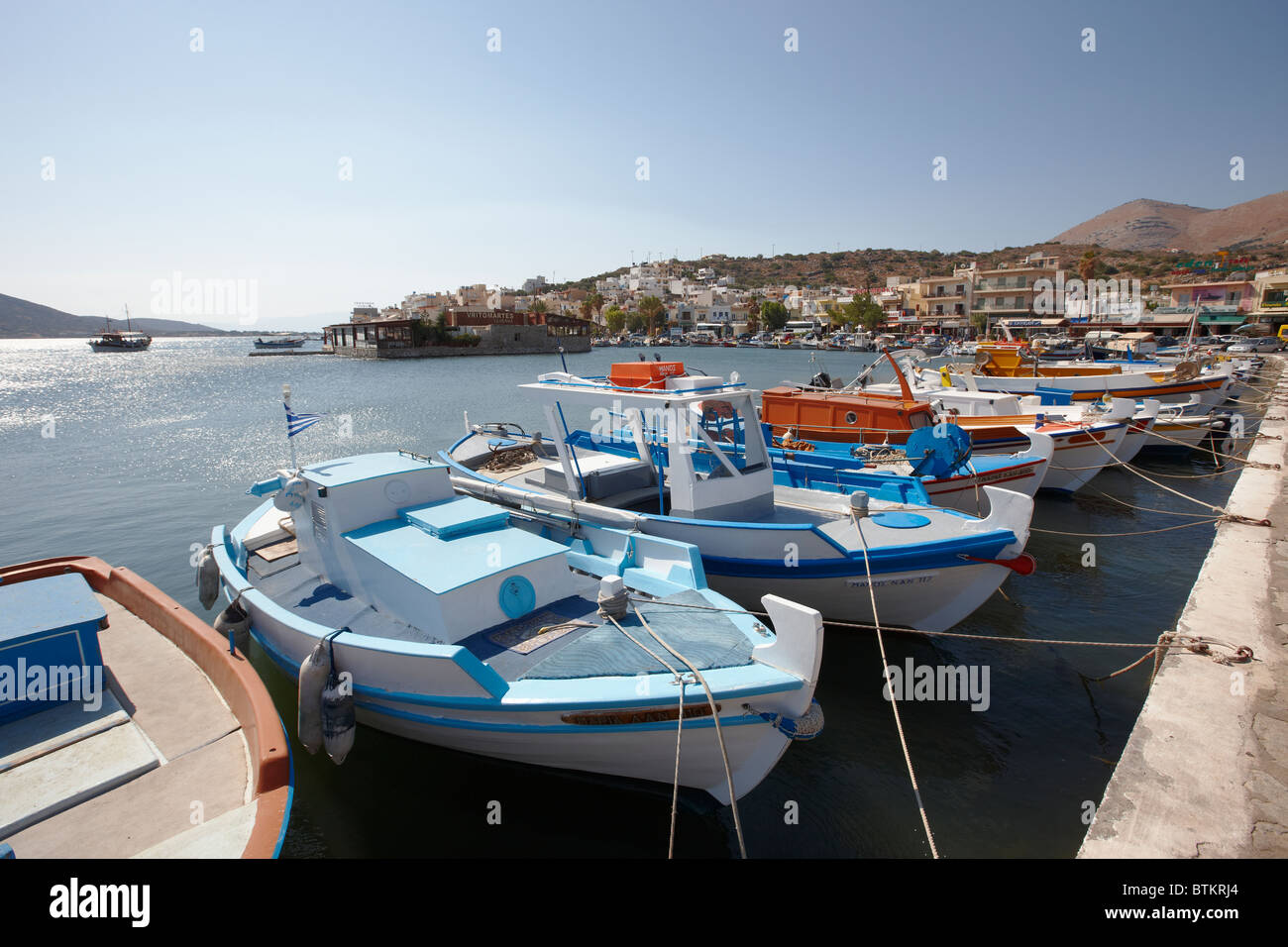 Fishing boats in Elounda village harbour. Crete, Greece Stock Photo - Alamy