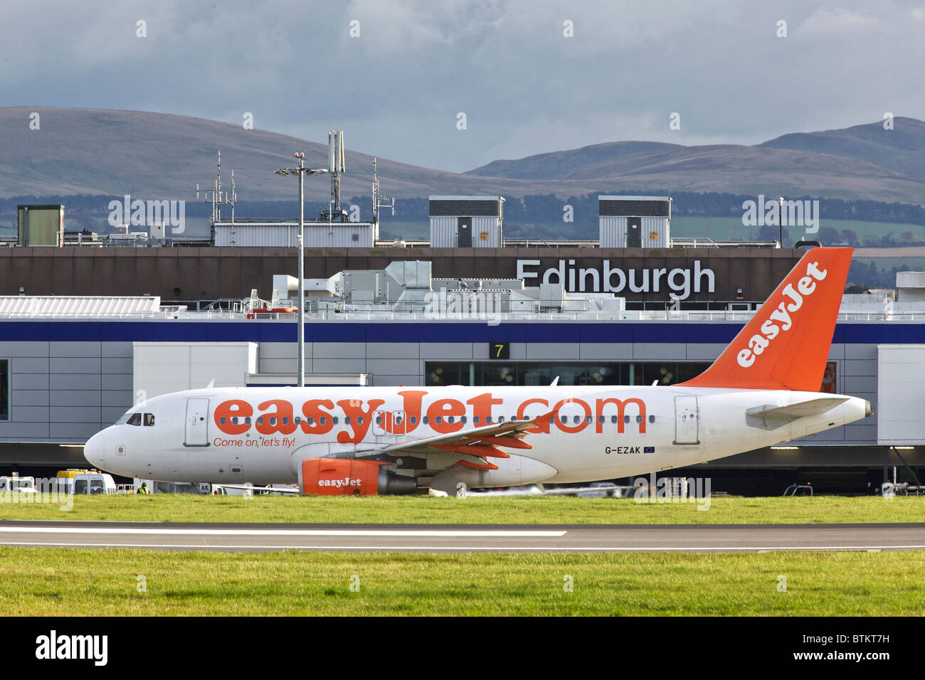 An Easyjet Plane on the tarmac at Edinburgh airport with the terminal ...