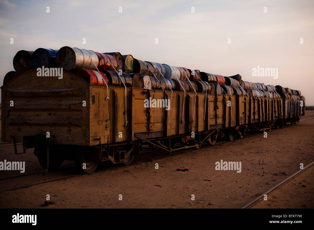 Train wagon loaded with old barrels Stock Photo - Alamy