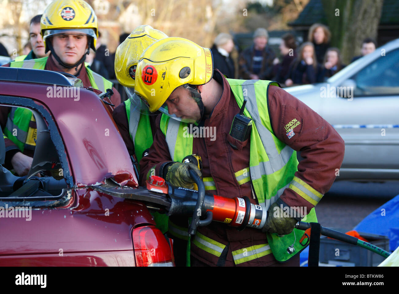 London firefighter using jaws of life Stock Photo - Alamy