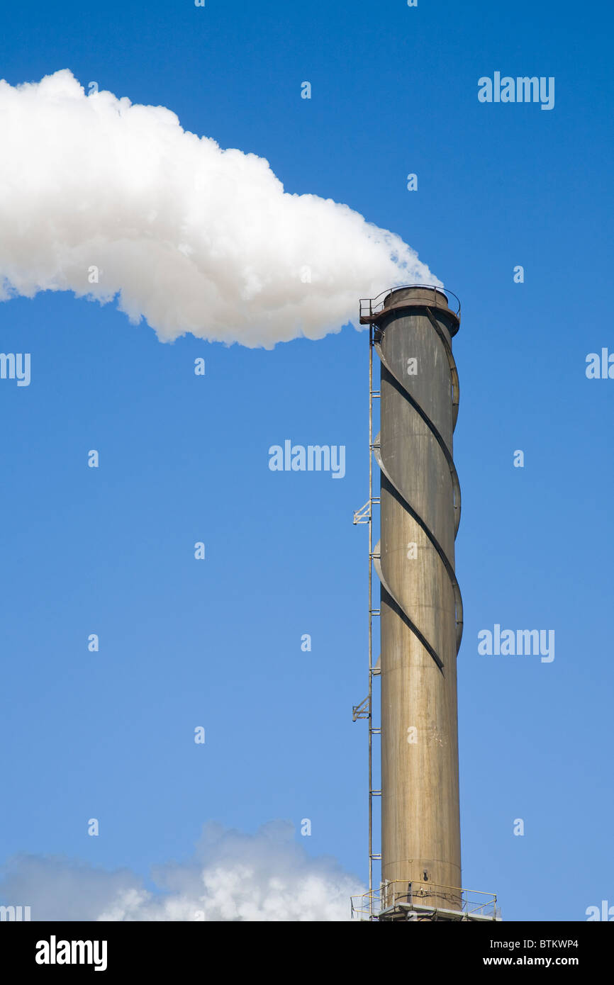 Industrial chimney spews smoke Stock Photo - Alamy