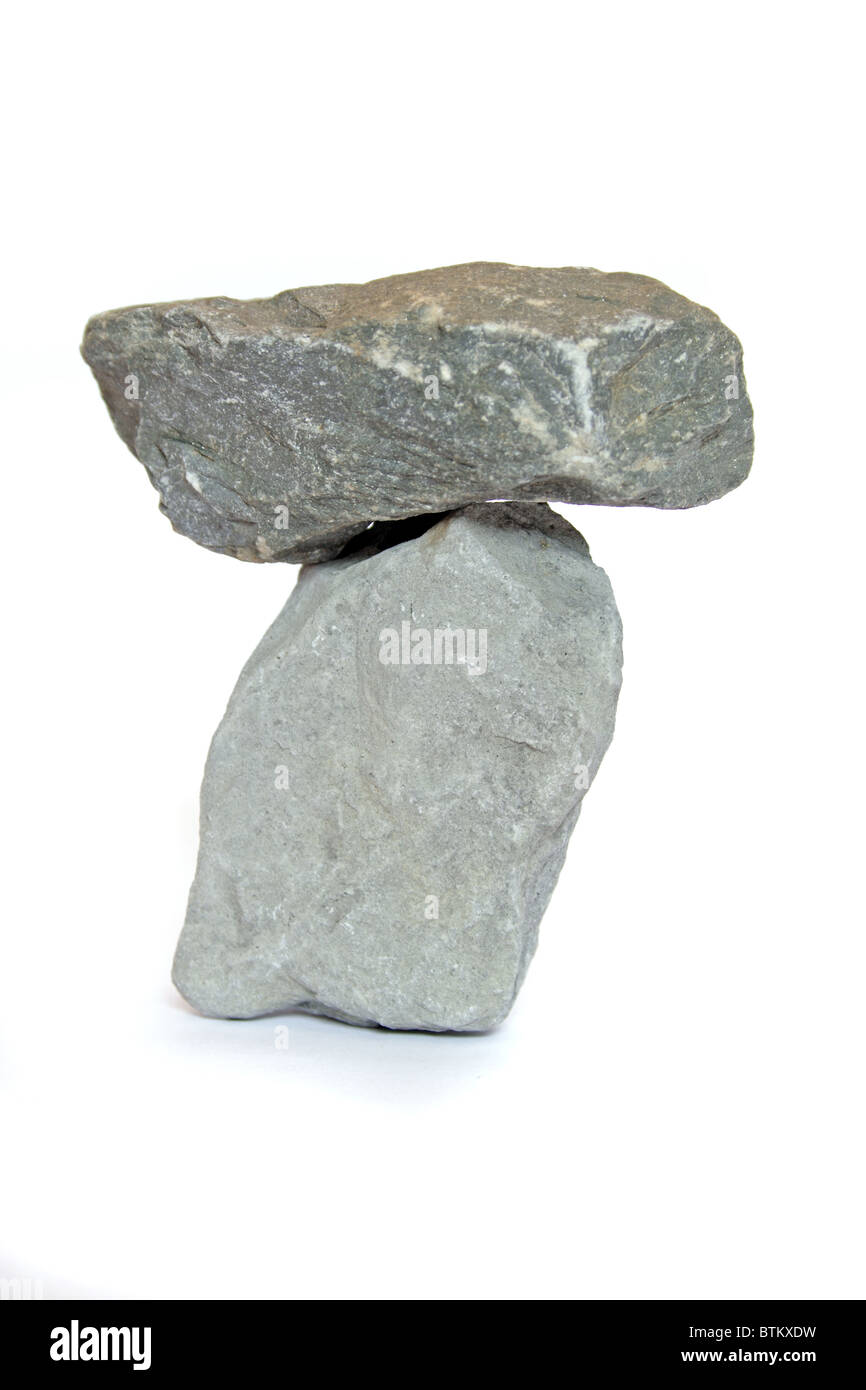 Two rocks one upon the other. All isolated on white background Stock ...