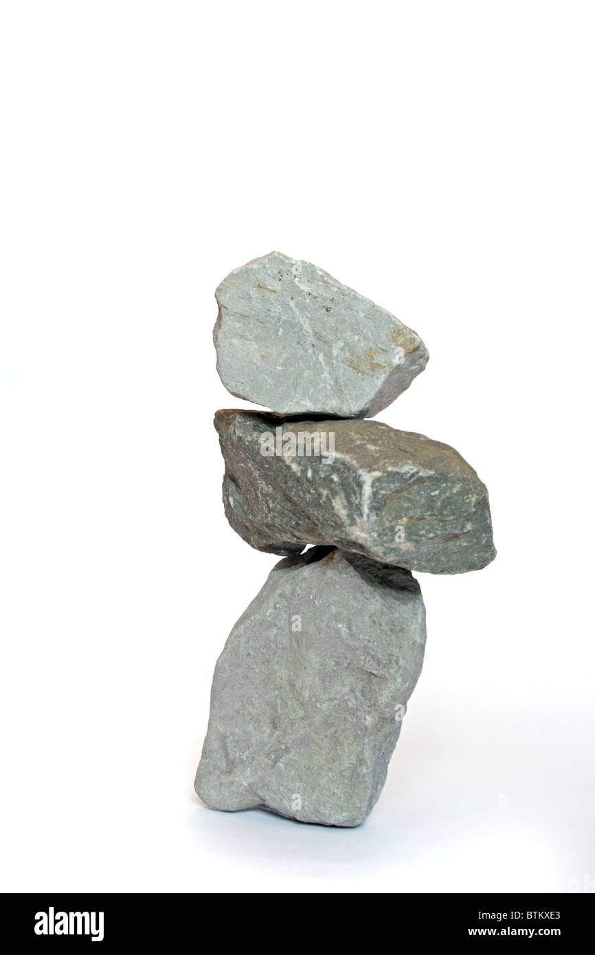 Three rocks one upon the other. All isolated on white background Stock ...