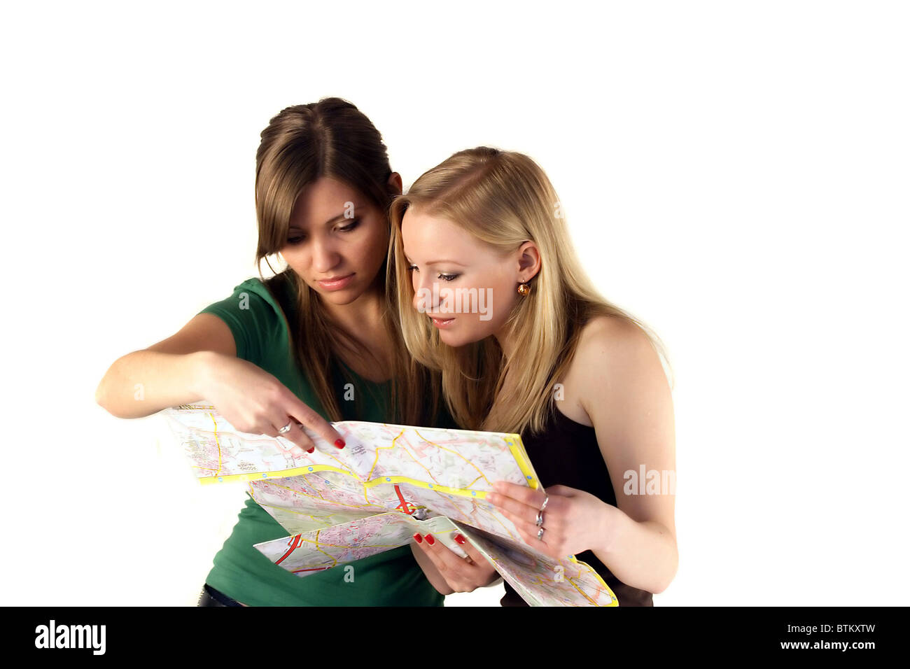 Two young handsome women on sightseeing tour. All isolated on white ...