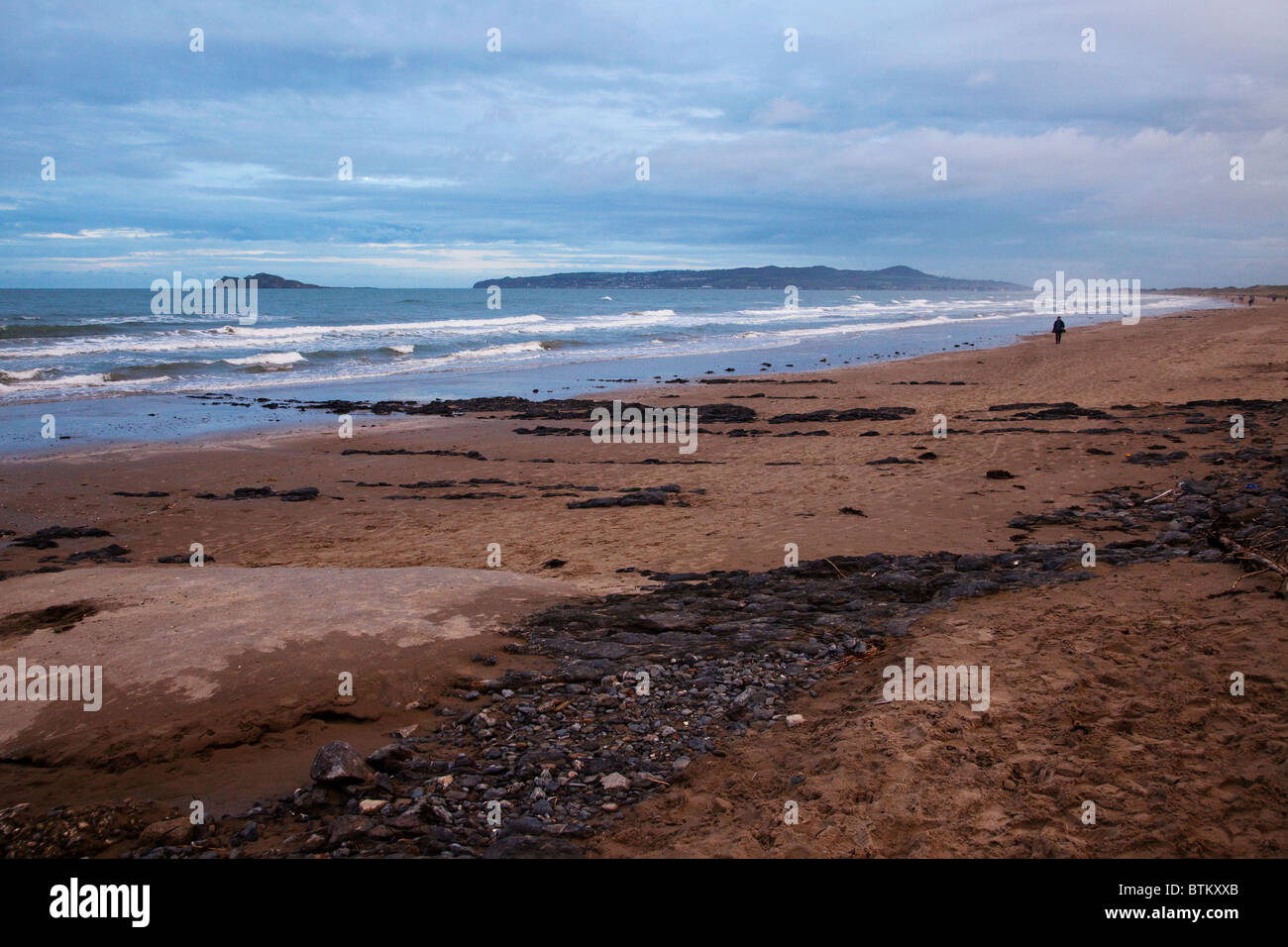 Portmarnock Beach with Howth Hill and Ireland's Eye island in ...