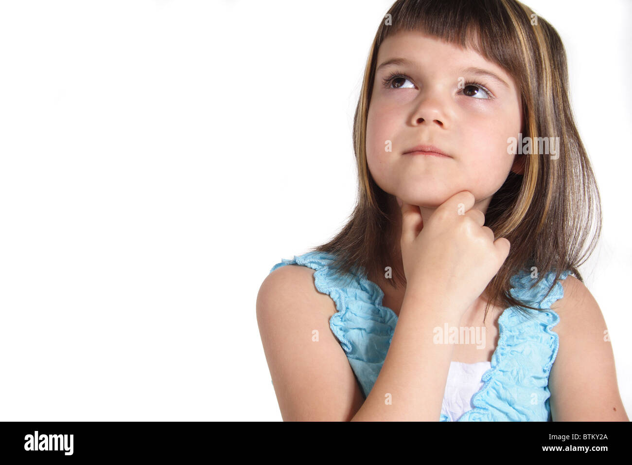A young girl thinking about something. All isolated on white background ...