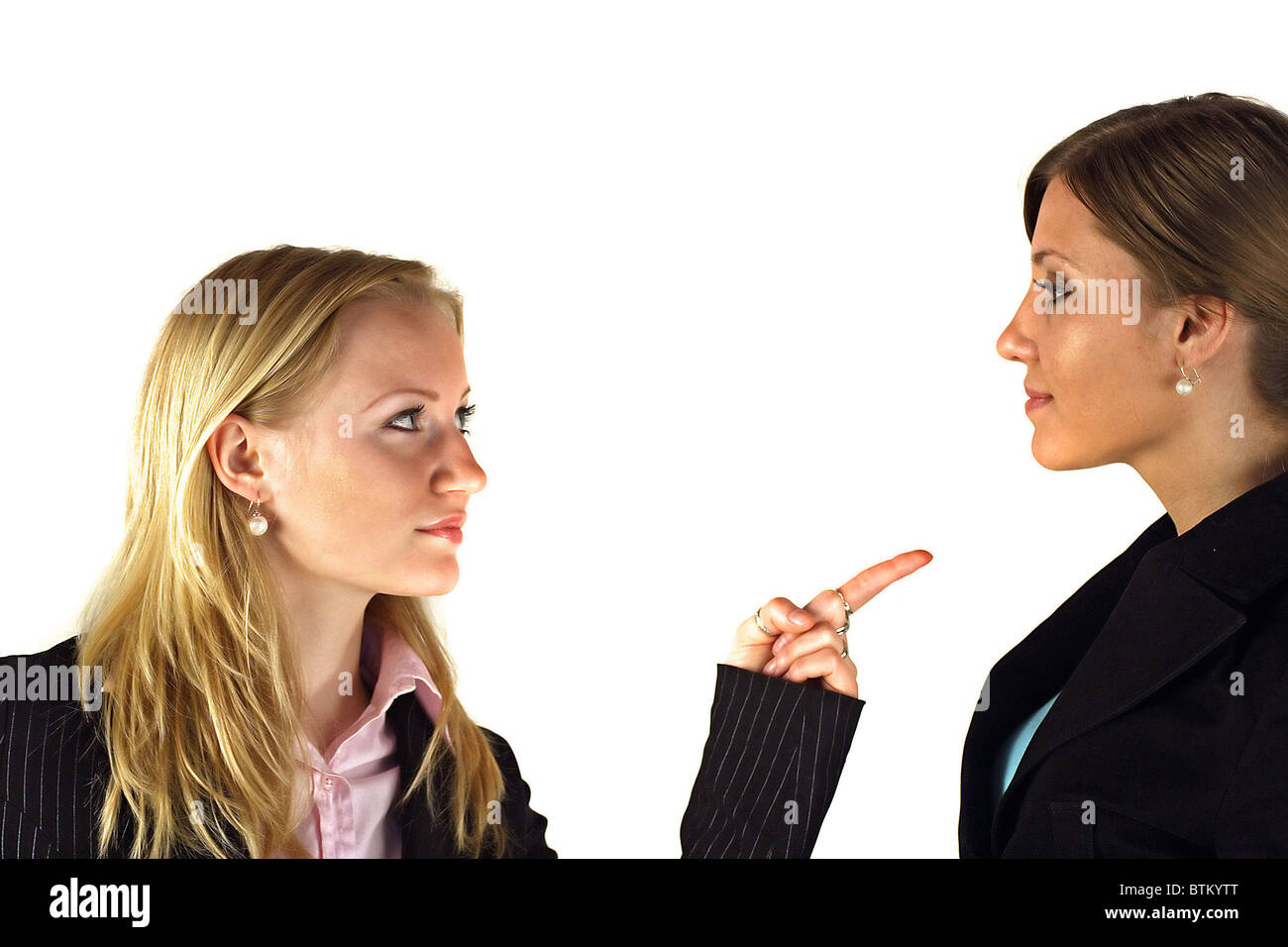 Two handsome women got a dispute. All isolated on white background ...