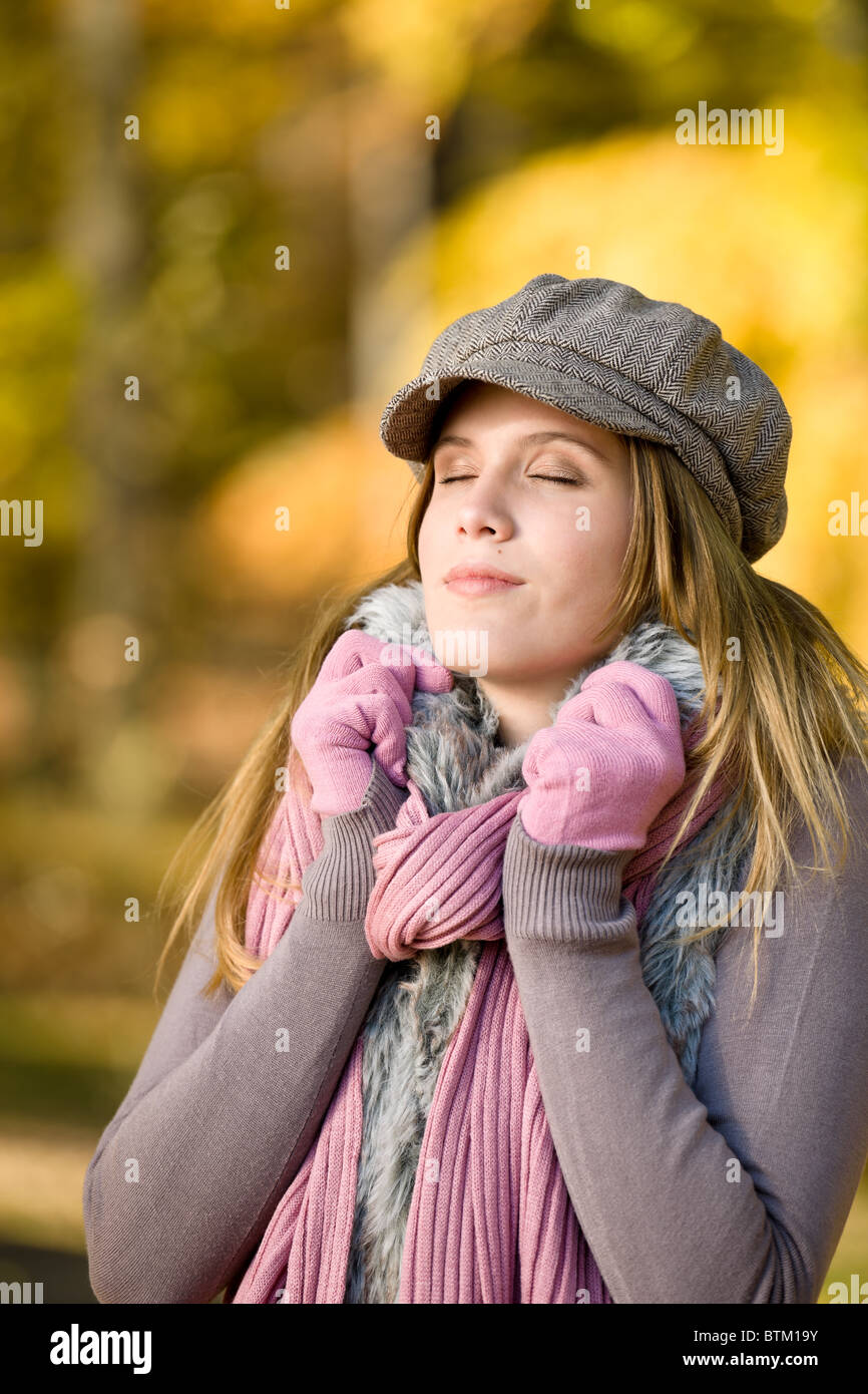Autumn park - fashion model woman wear cap on sunny day Stock Photo - Alamy