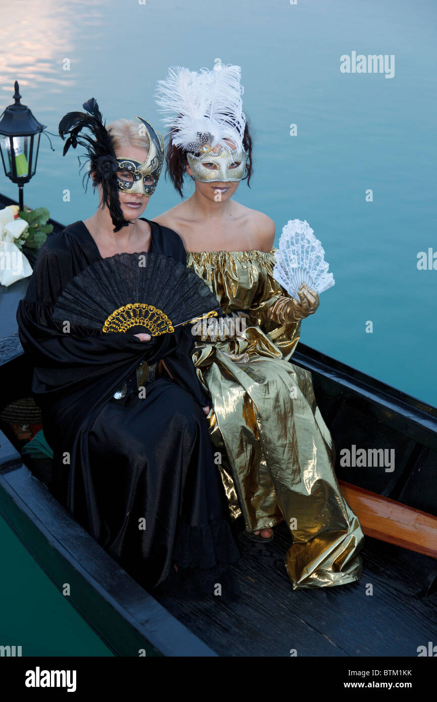 women with Venetian dress in Venetian gondola Stock Photo - Alamy