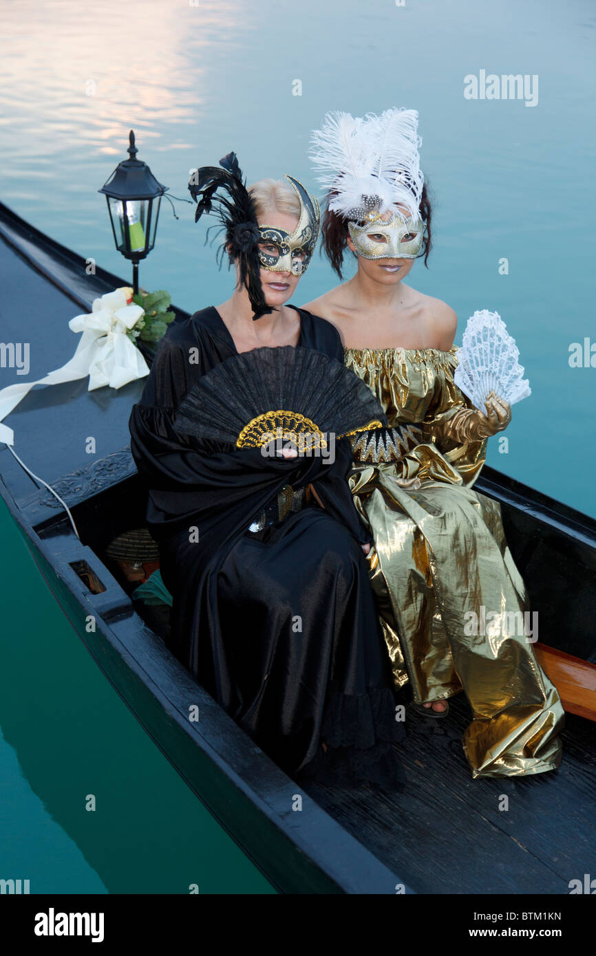 women with Venetian dress in Venetian gondola Stock Photo - Alamy