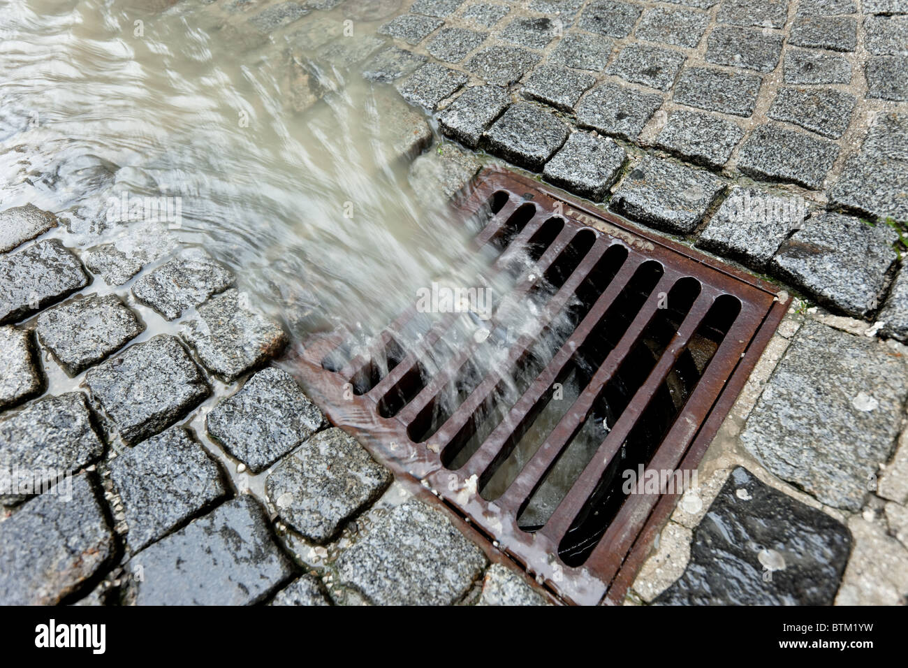 Metal sewer cover for rainwater Stock Photo - Alamy