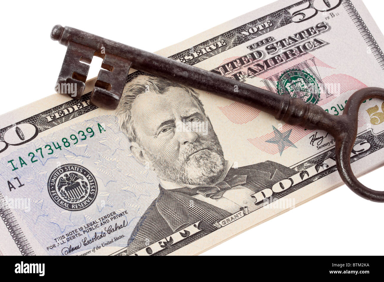 Many dollar bills and key Stock Photo - Alamy