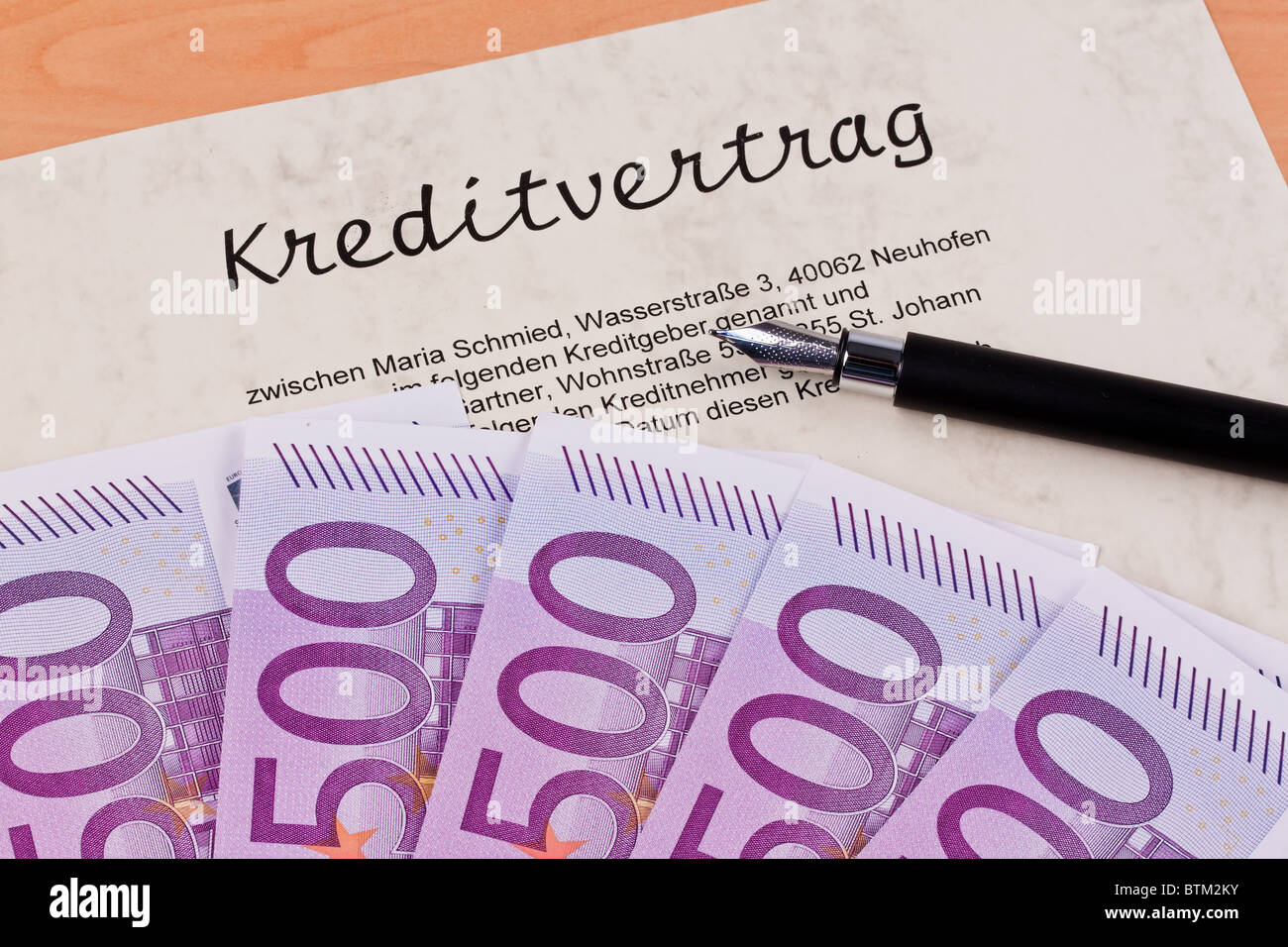 Many Euro banknotes and credit agreement Stock Photo - Alamy