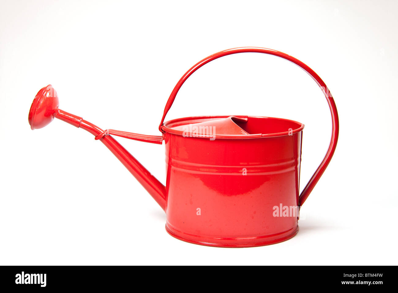 Red watering can isolated on white background Stock Photo - Alamy