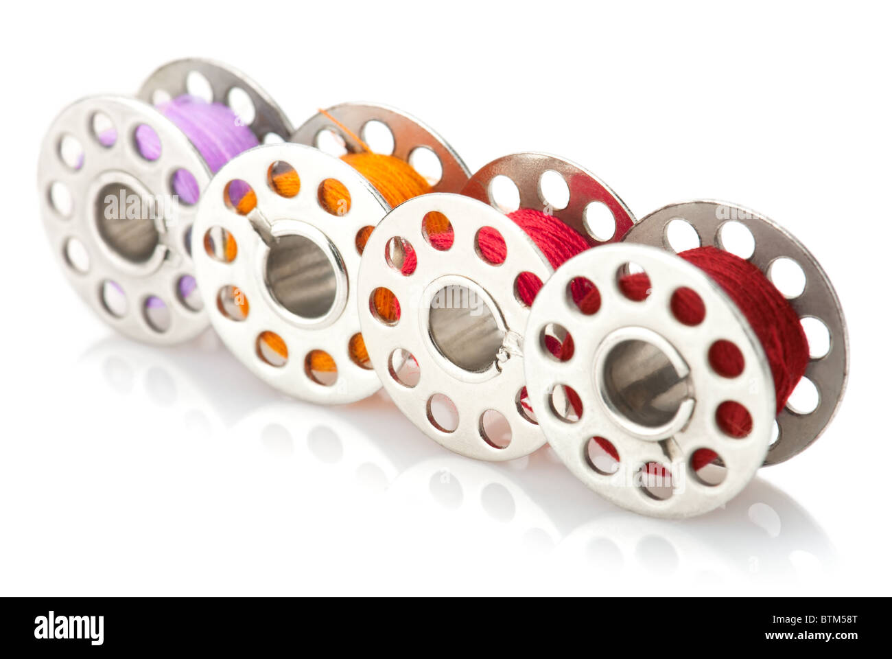 Colored bobbins for machine sewing Stock Photo - Alamy