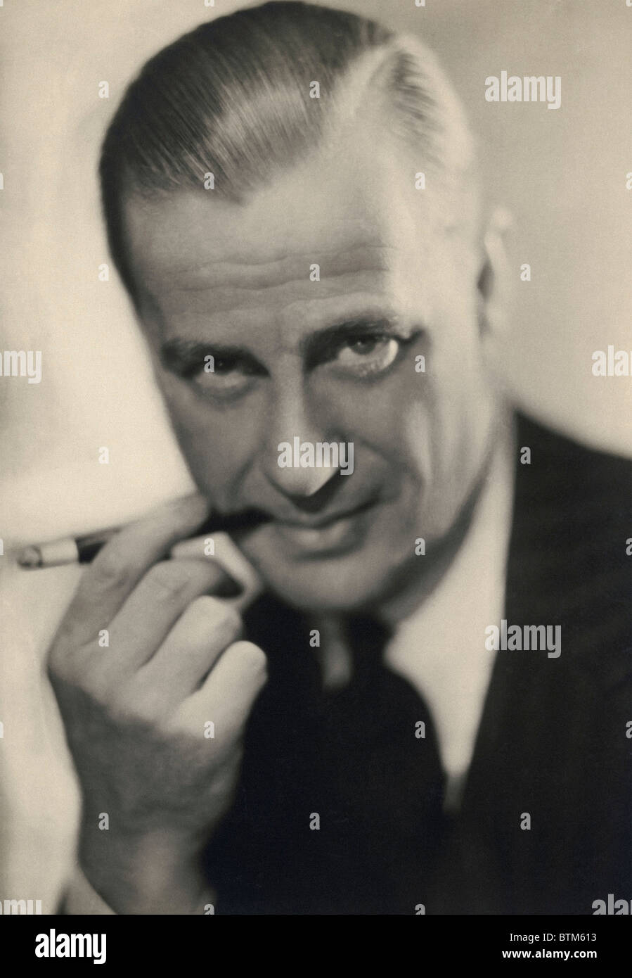 Historical photo (1910) of a man smoking a cigarette Stock Photo - Alamy