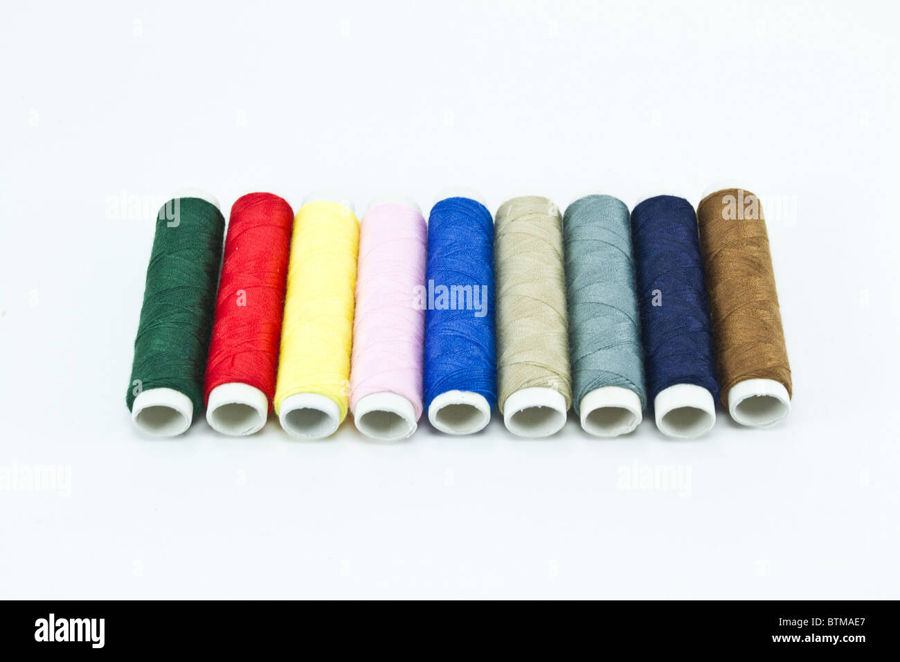 many colorful spools of thread Stock Photo - Alamy