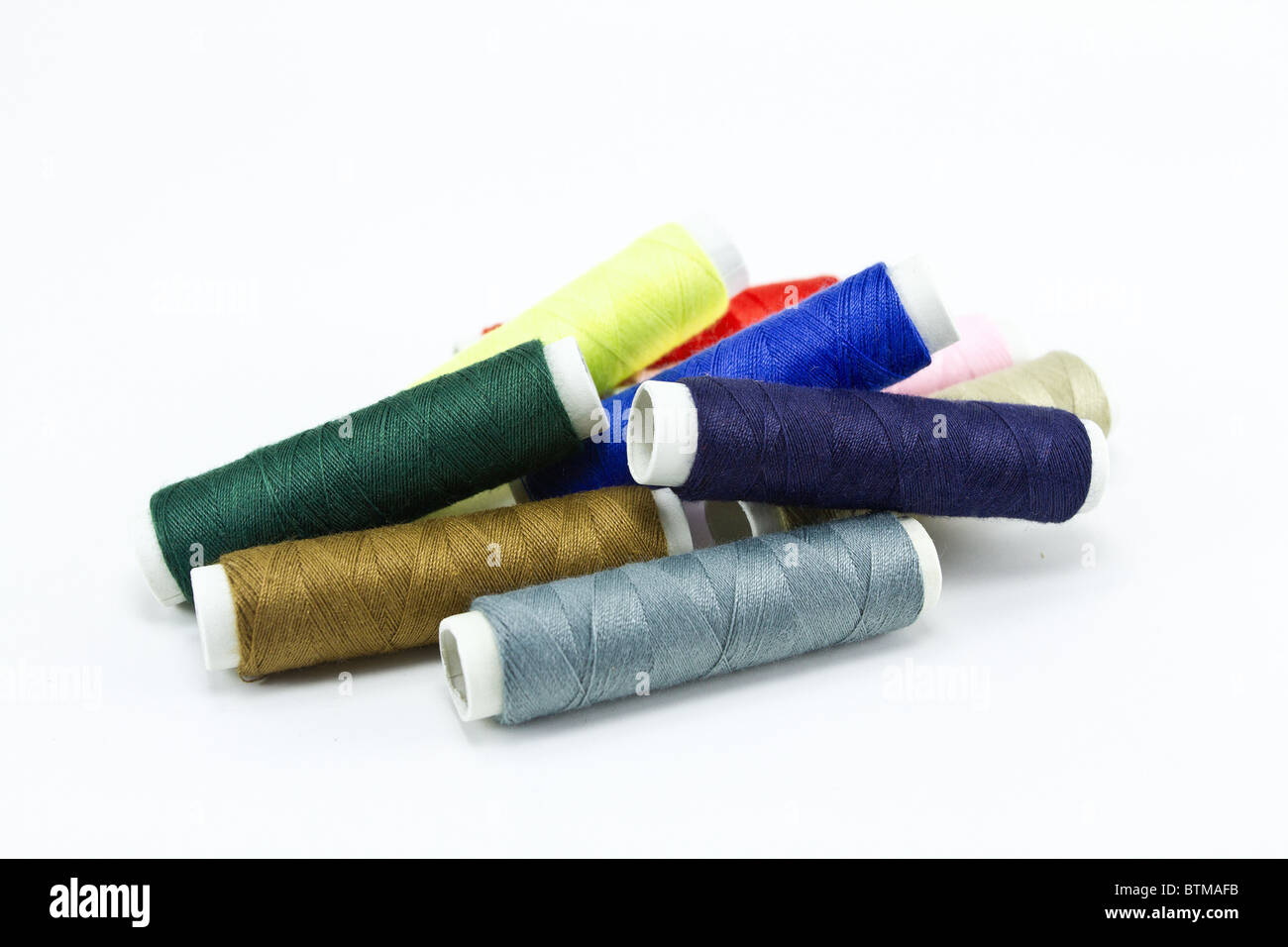 many colorful spools of thread Stock Photo - Alamy