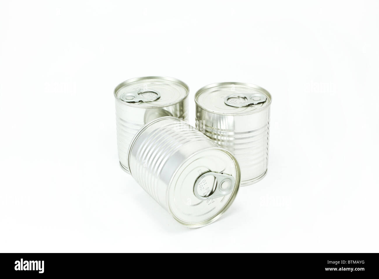 Three tin cans isolated on white background Stock Photo - Alamy