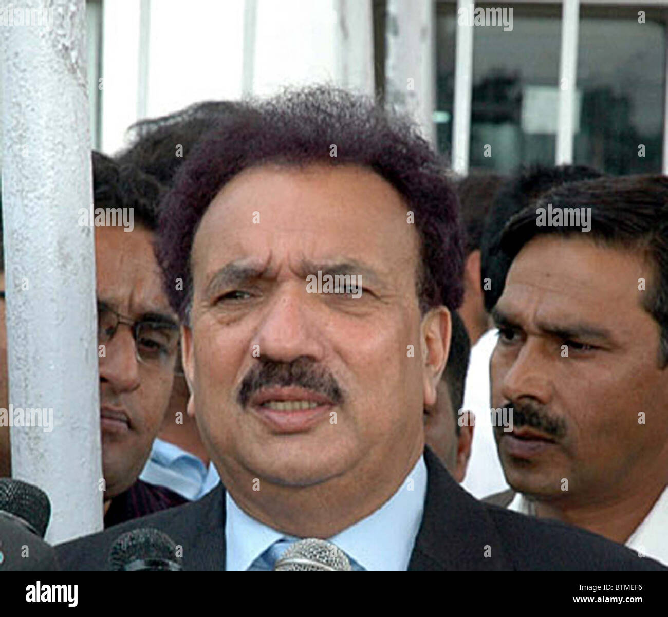 Federal Minister for Interior, Rehman Malik talks with mediamen at ...